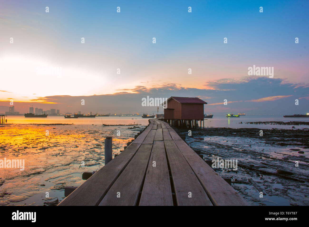 Wooden bridge Clan Tan Jetty view during sunrise in George Town, Penang ...