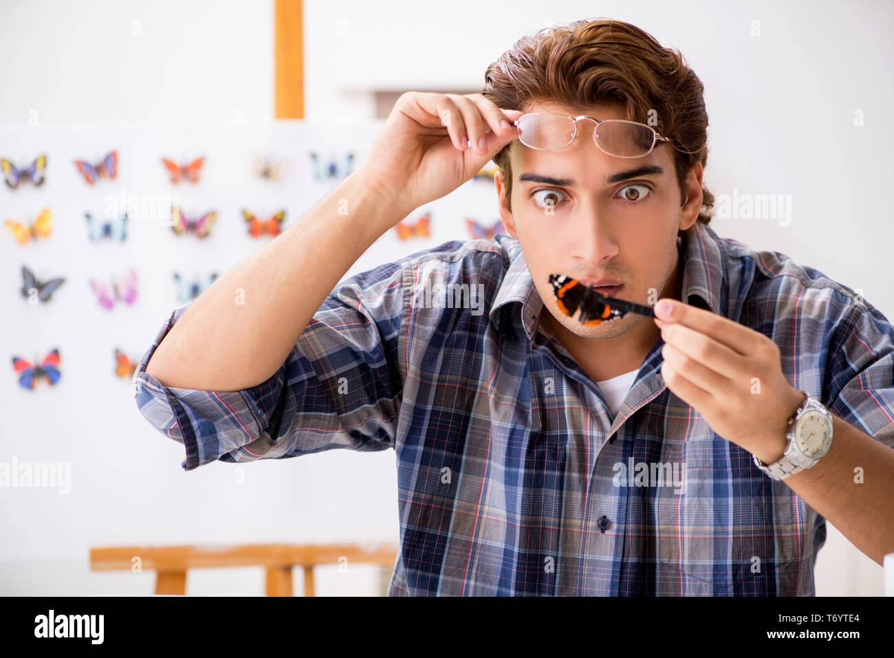 The student entomologist studying new species of butterflies Stock ...