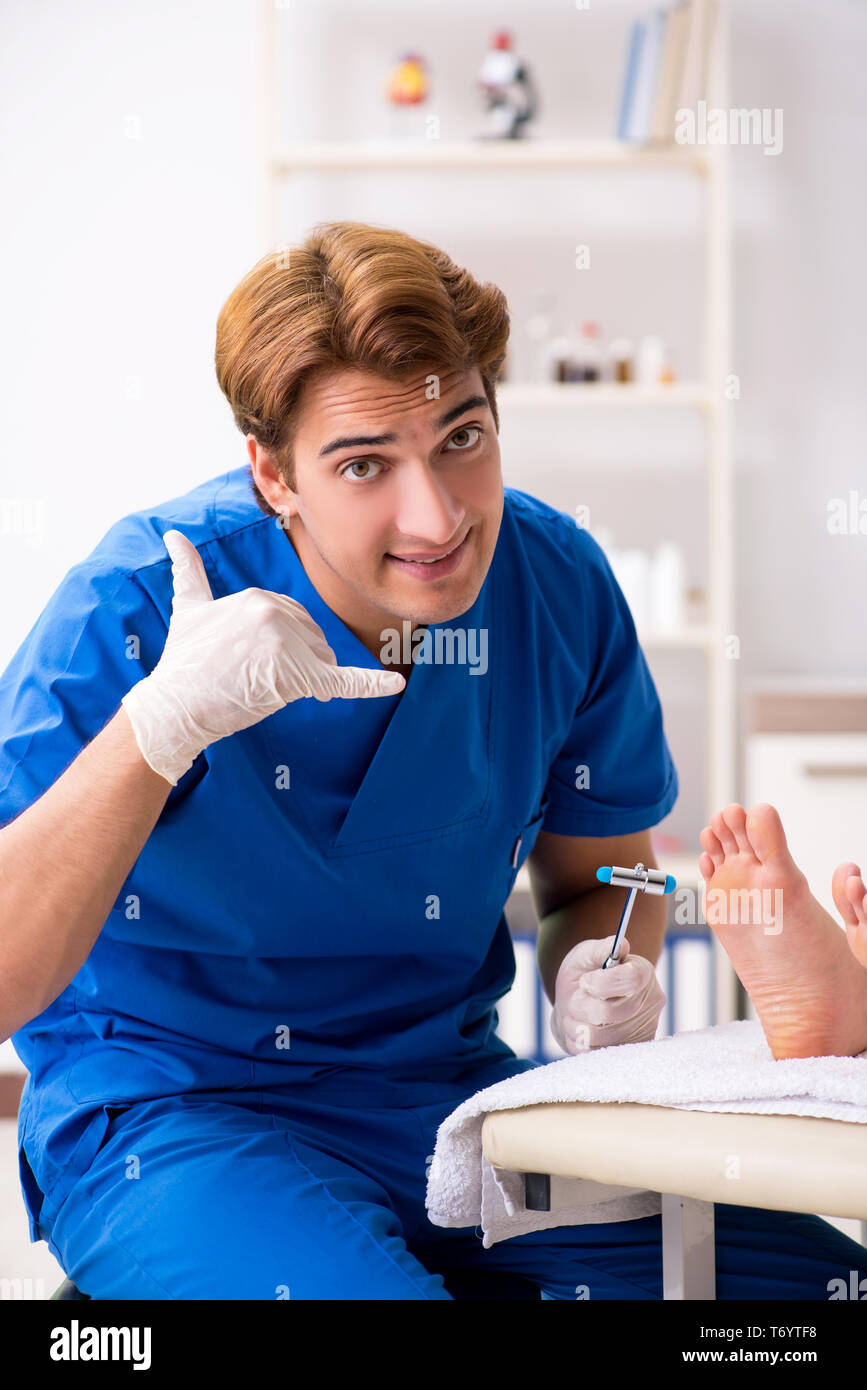 The podiatrist treating feet during procedure Stock Photo - Alamy