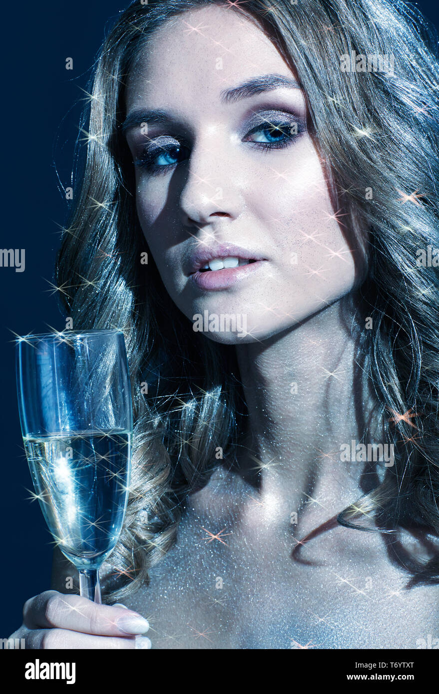 Girls with glass of champagne in hand Stock Photo - Alamy