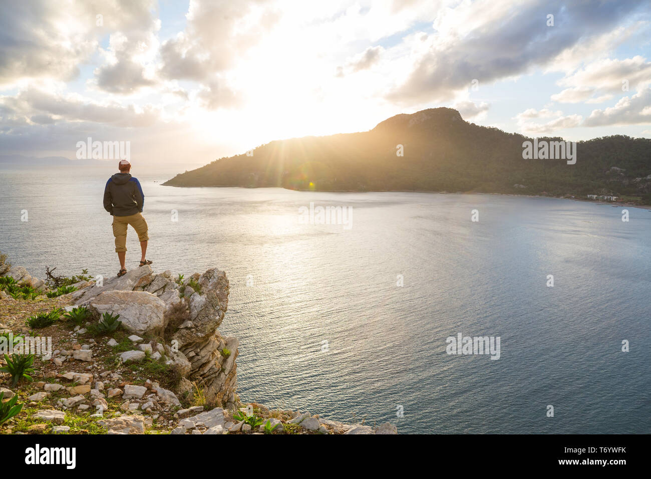 Man on the cliff Stock Photo - Alamy