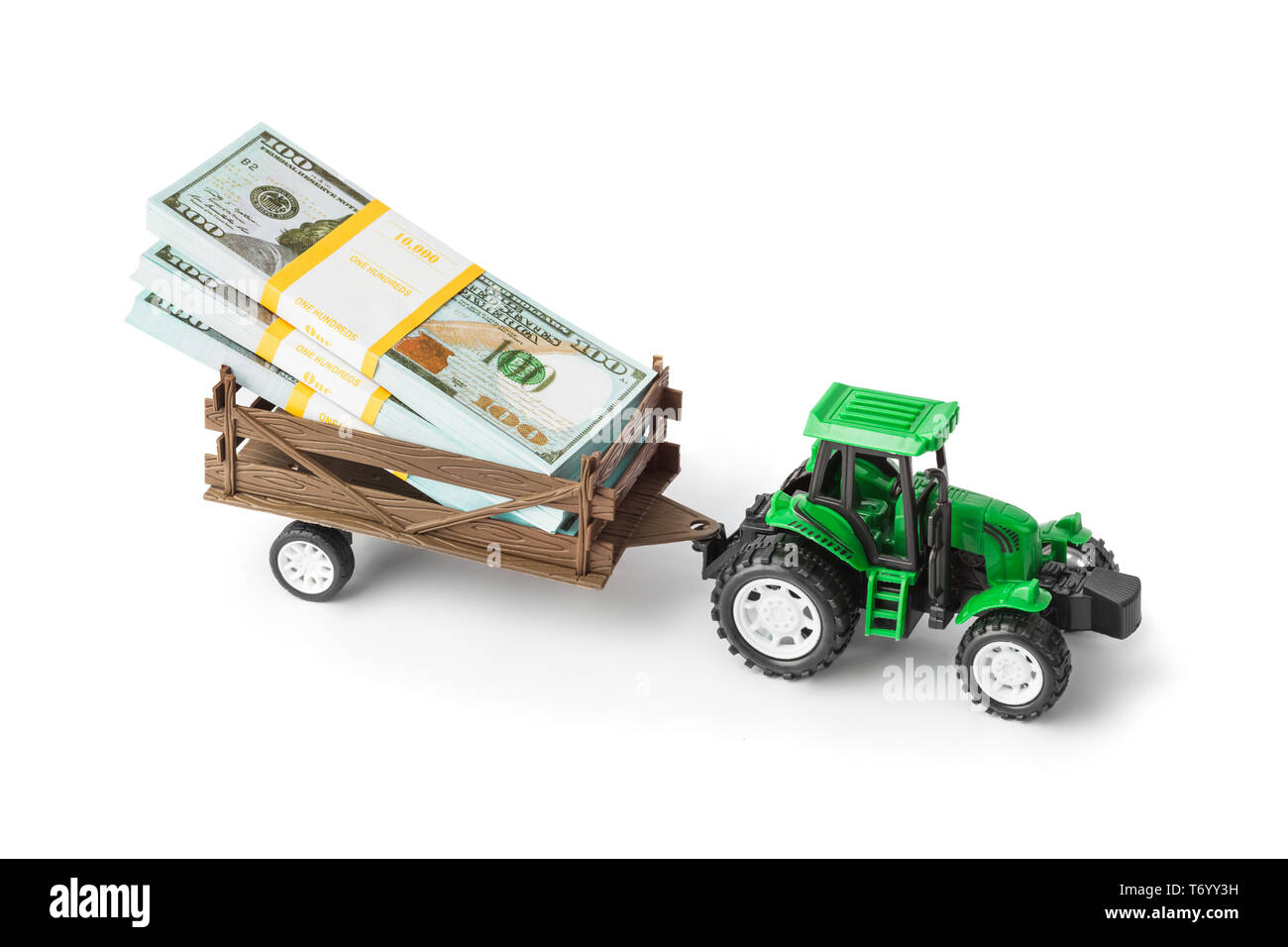 Toy tractor with money Stock Photo - Alamy