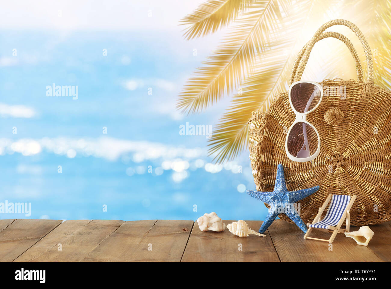 vacation and summer concept with sea life style objects over wooden ...