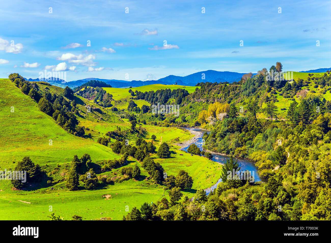 Narrow river between wooded hills Stock Photo - Alamy