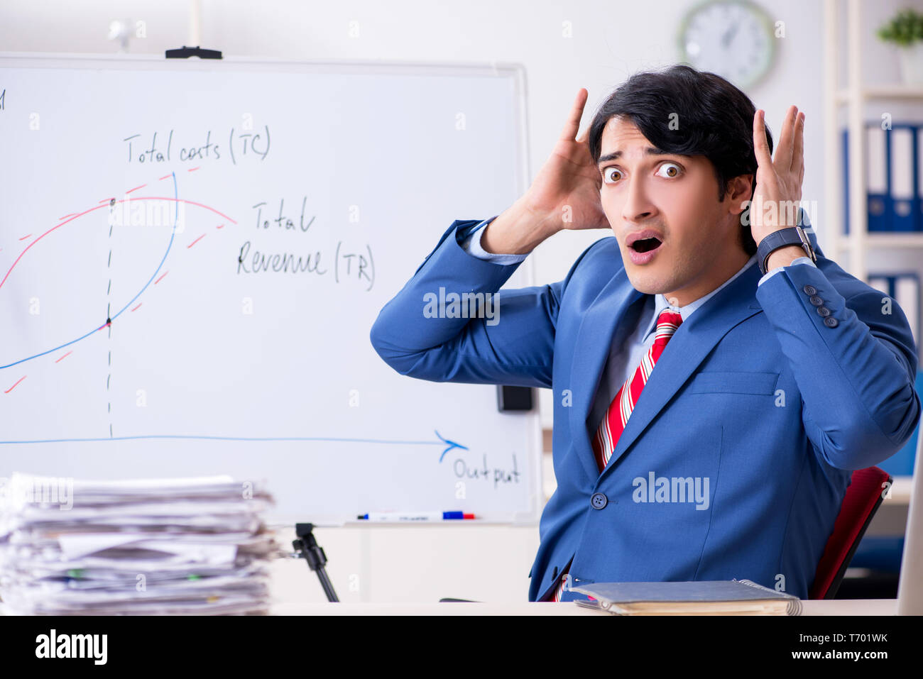 Busy businessman explaining business charts Stock Photo - Alamy