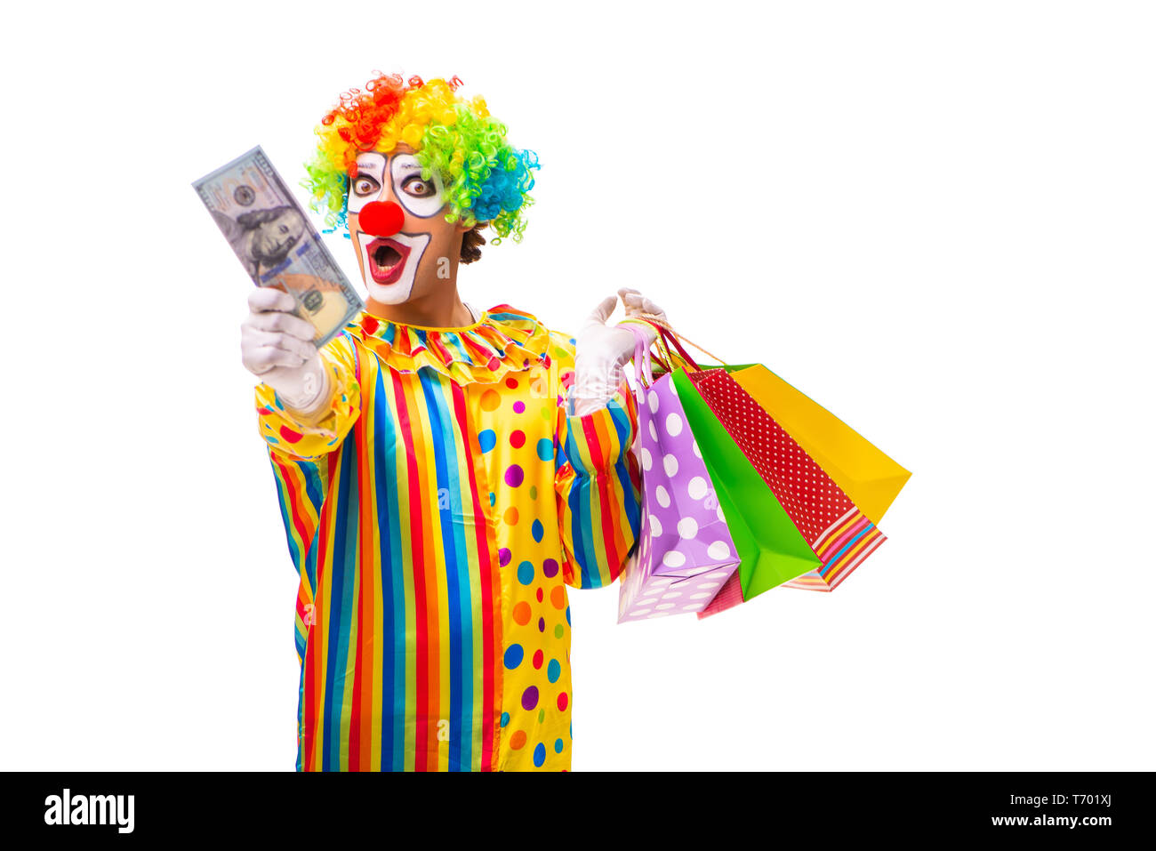 Happy male clown holding present hi-res stock photography and images ...