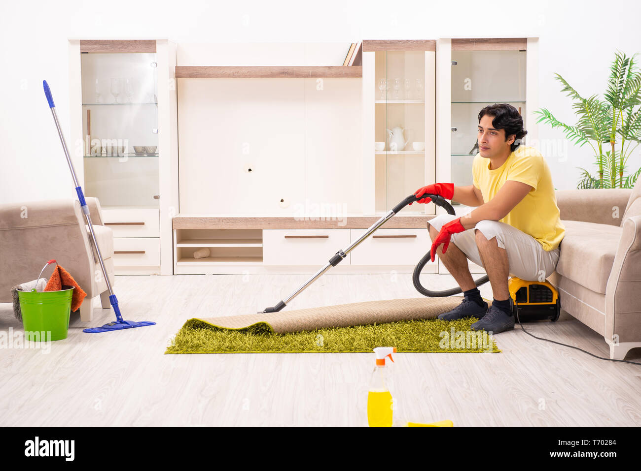 Frustrated man doing housework hi-res stock photography and images - Alamy