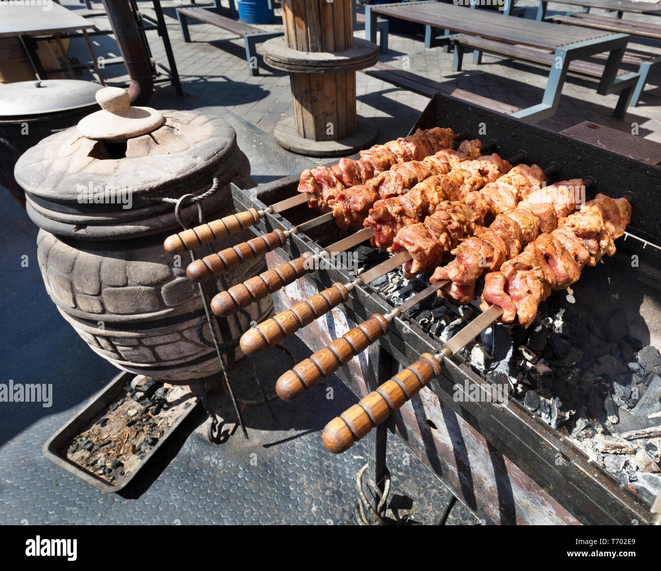 Raw meat is prepared on skewers grilled barbecue on charcoal. Grill on ...