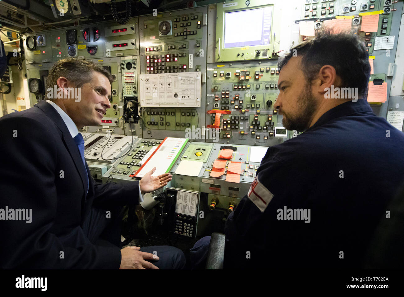 Former Defence Secretary Gavin Williamson (left) during a visit to HMS ...