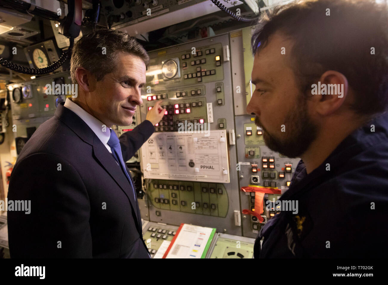 Former Defence Secretary Gavin Williamson (left) during a visit to HMS ...