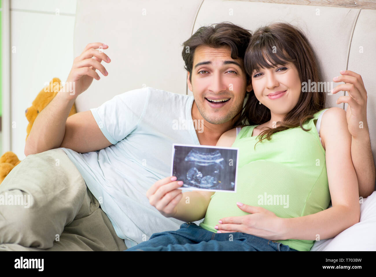 Young family finding out about pregnancy Stock Photo - Alamy