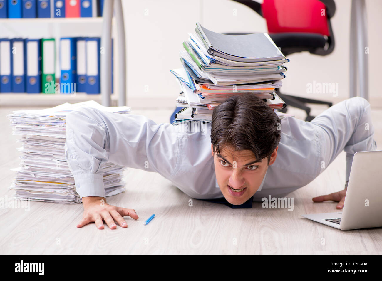 Extremely busy employee working in the office Stock Photo - Alamy