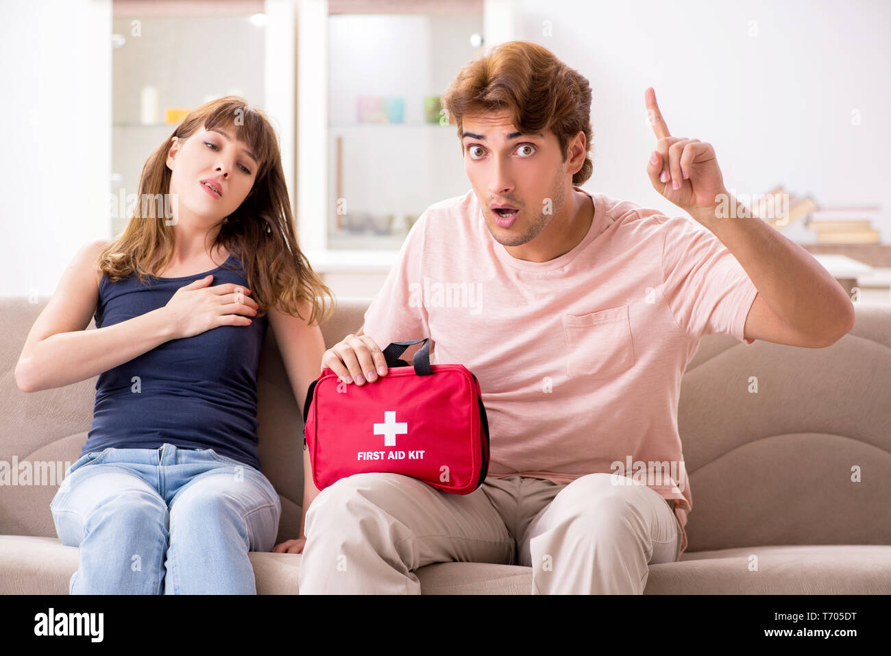 Young family getting treatment with first aid kit Stock Photo - Alamy