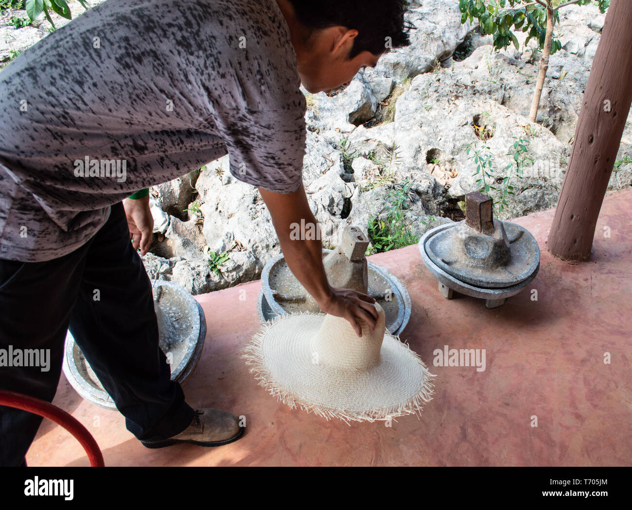 A tour guide at the Becal museum teaching how Panama hats are made ...