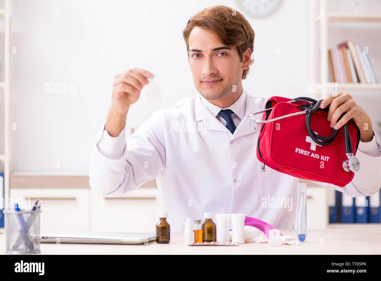Young doctor with first aid kit in hospital Stock Photo - Alamy