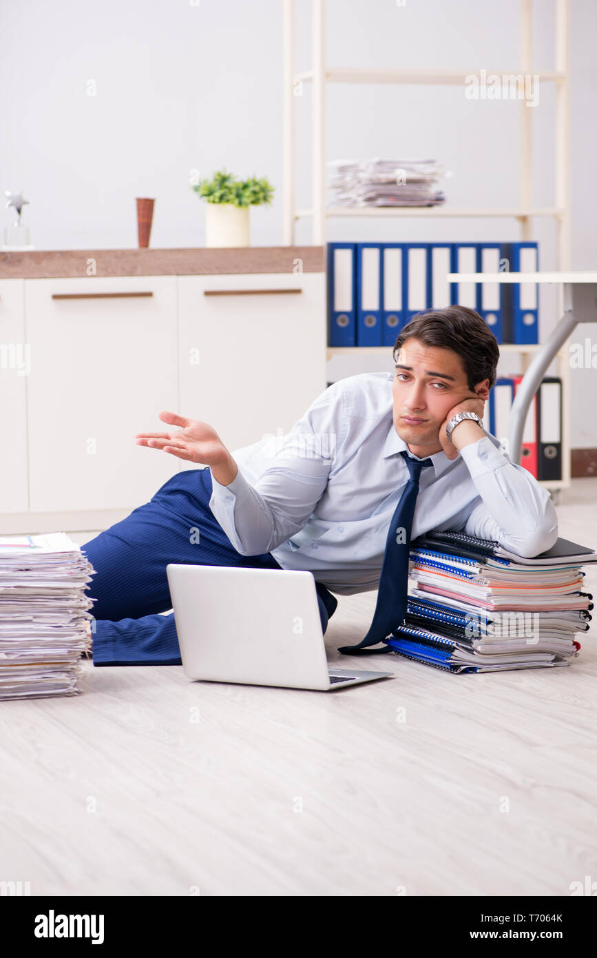 Extremely busy employee working in the office Stock Photo - Alamy