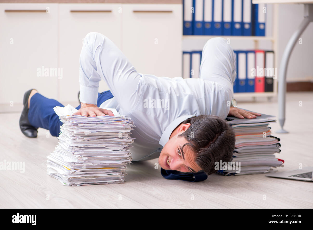 Extremely busy employee working in the office Stock Photo - Alamy