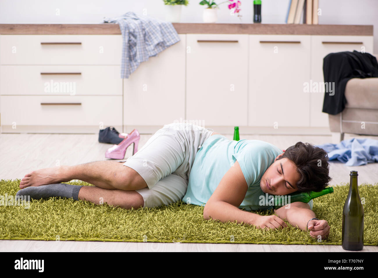 The young drunk handsome man after party at home Stock Photo - Alamy