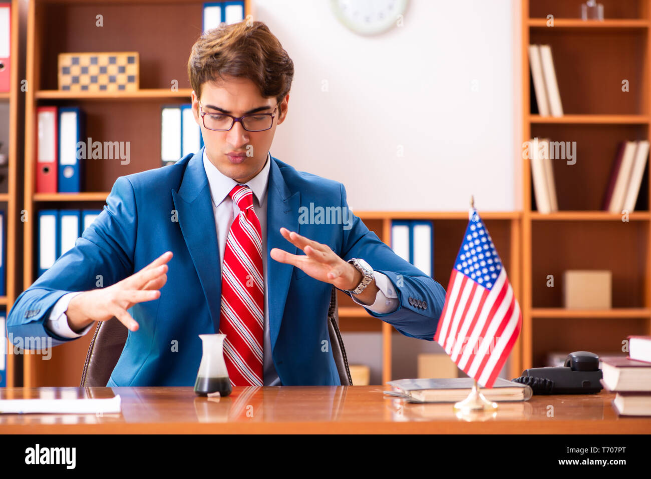 The young handsome politician sitting in office Stock Photo - Alamy