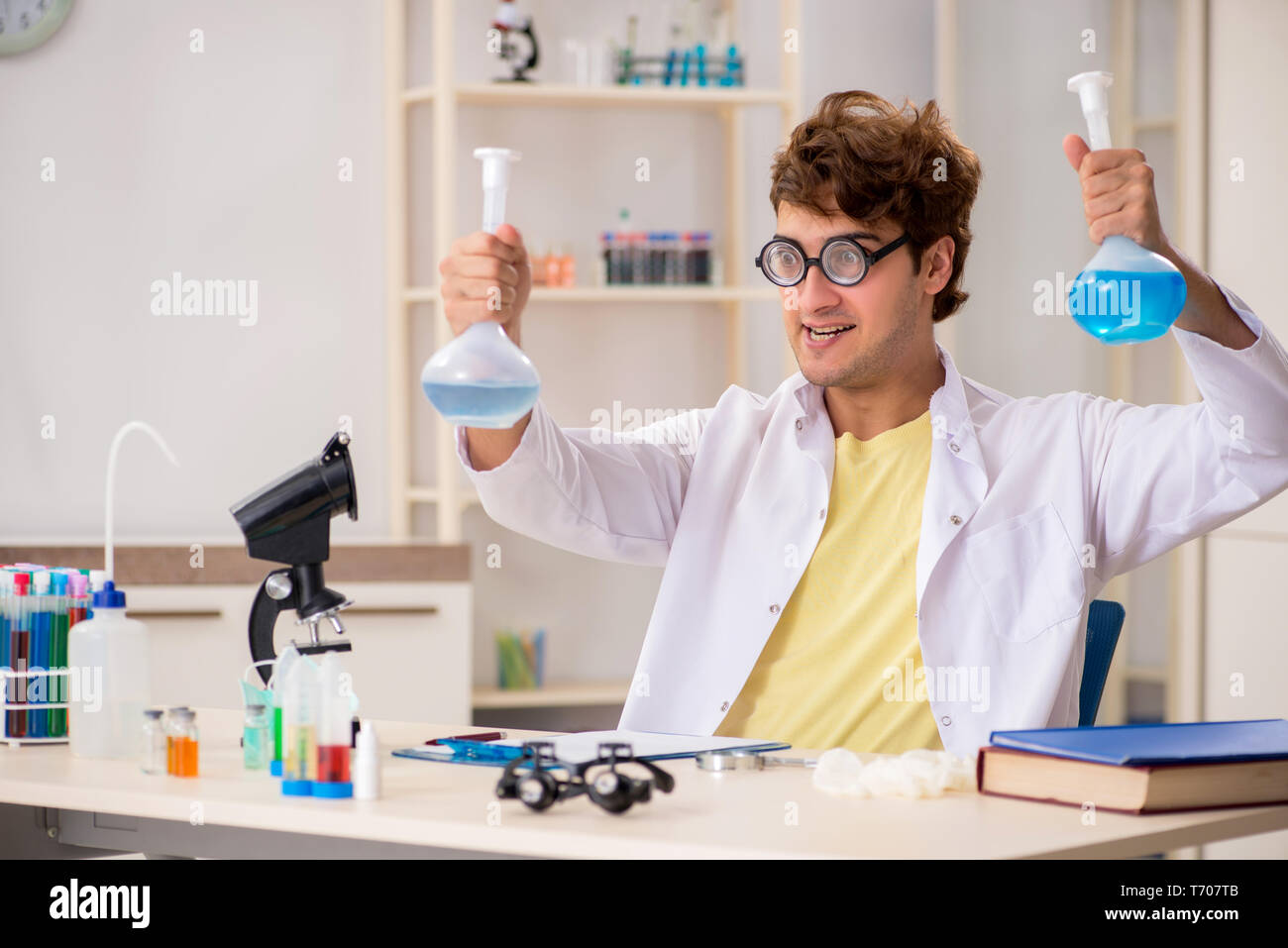 The funny crazy chemist doing experiments and tests Stock Photo - Alamy