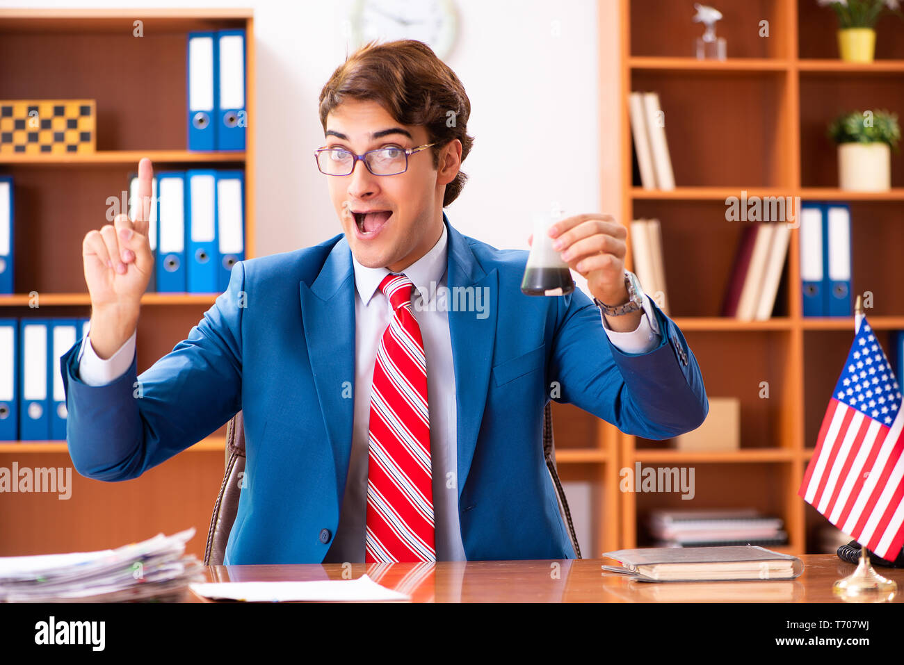 The young handsome politician sitting in office Stock Photo - Alamy