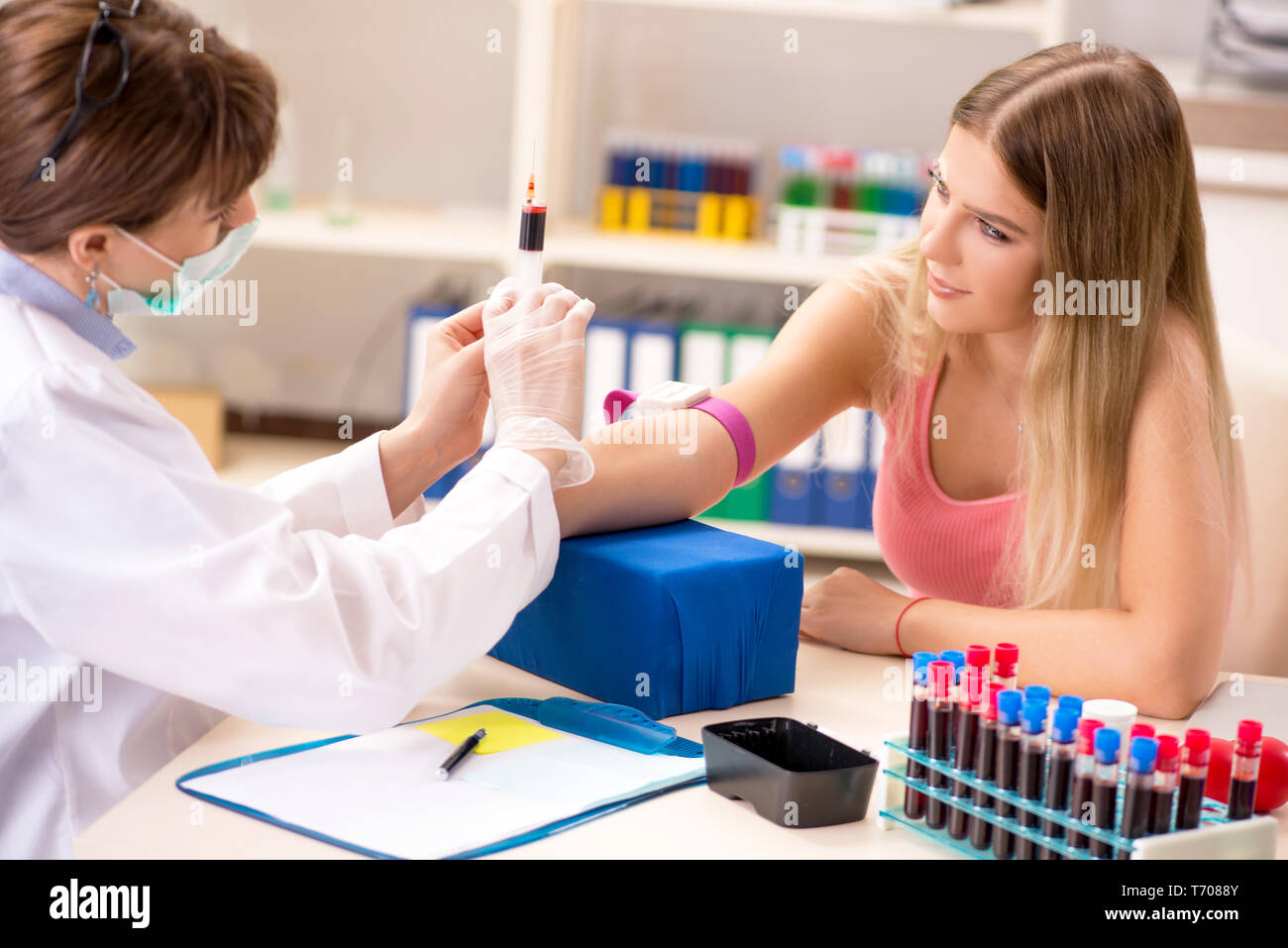 The young beautiful woman during blood test sampling procedure Stock ...