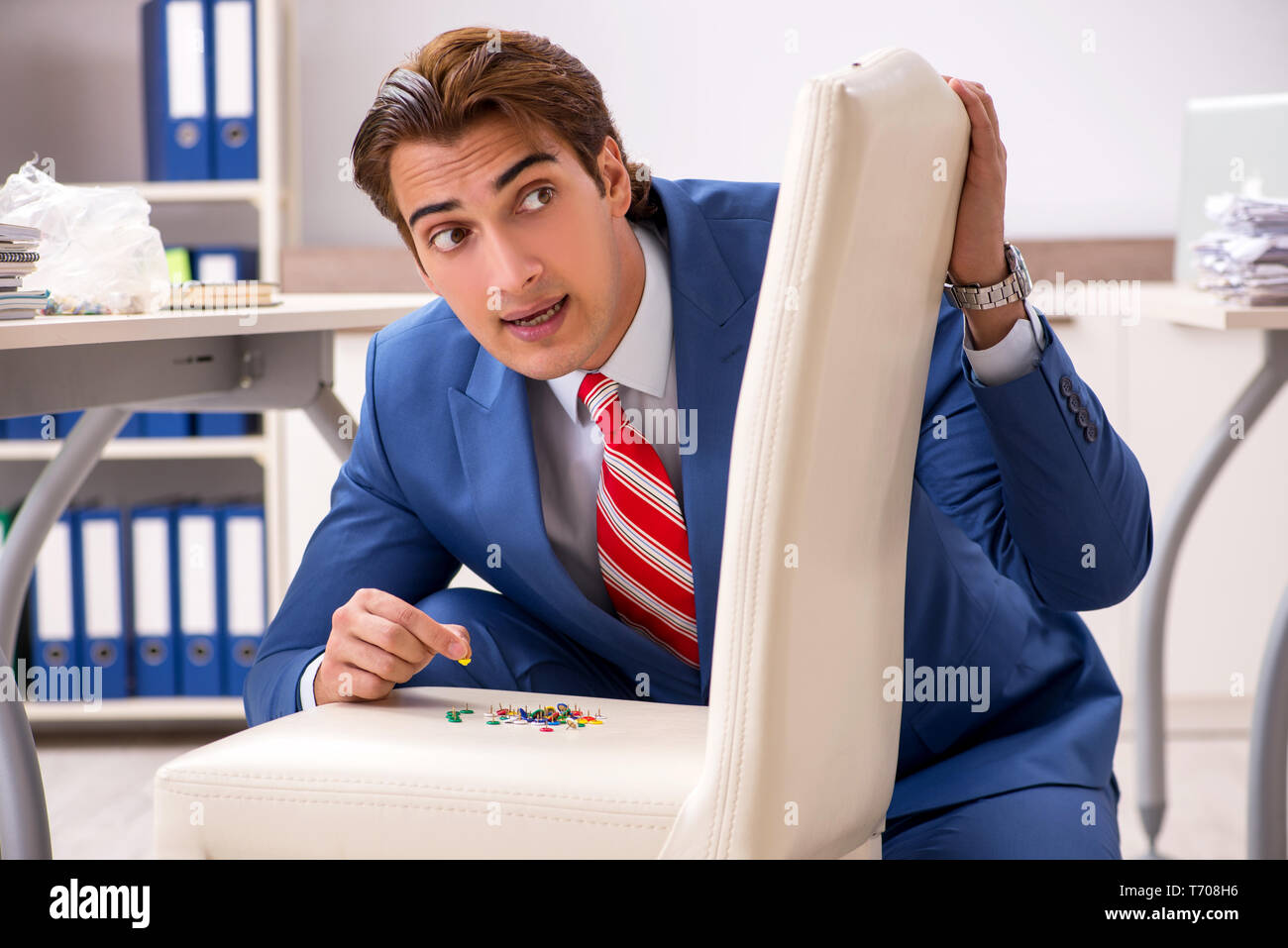 The office prank with sharp thumbtacks on chair Stock Photo - Alamy