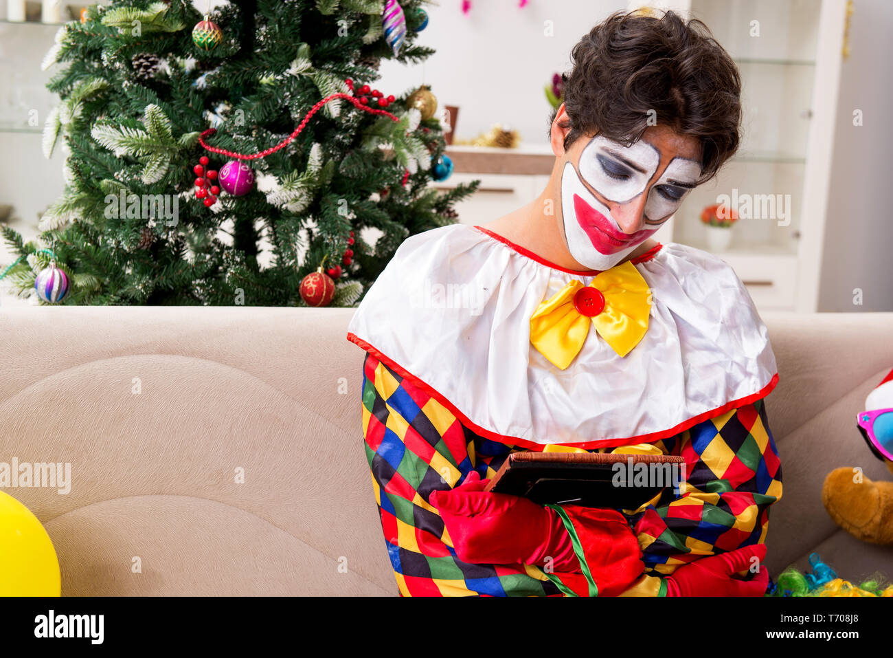 The funny clown in christmas celebration concept Stock Photo - Alamy