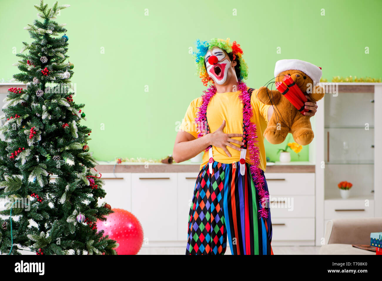 The funny clown in christmas celebration concept Stock Photo - Alamy