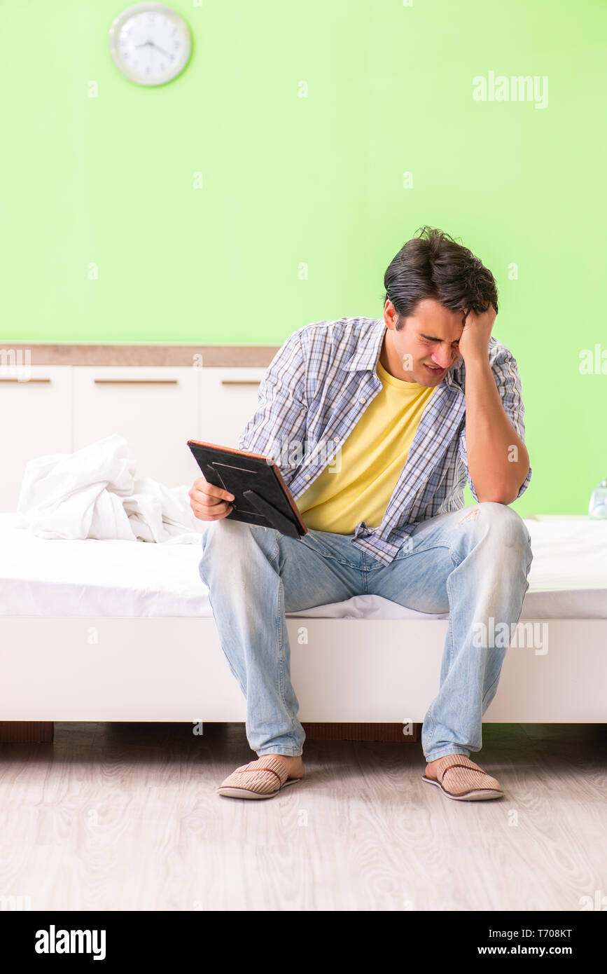 The young man sad in unhappy love concept Stock Photo - Alamy