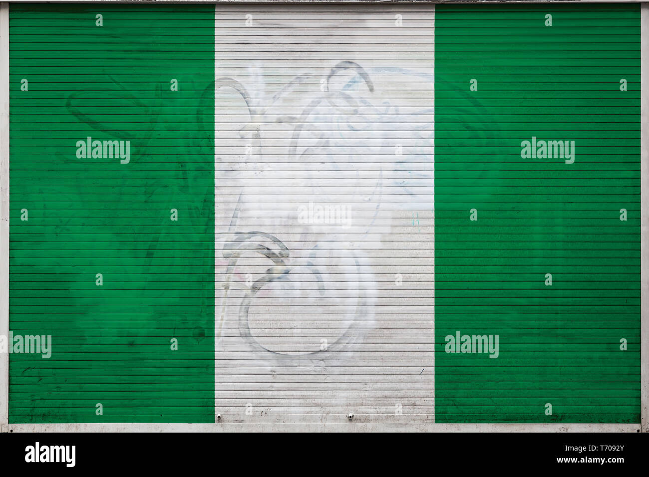 Close-up of old metal wall with national flag of Nigeria. Concept of ...