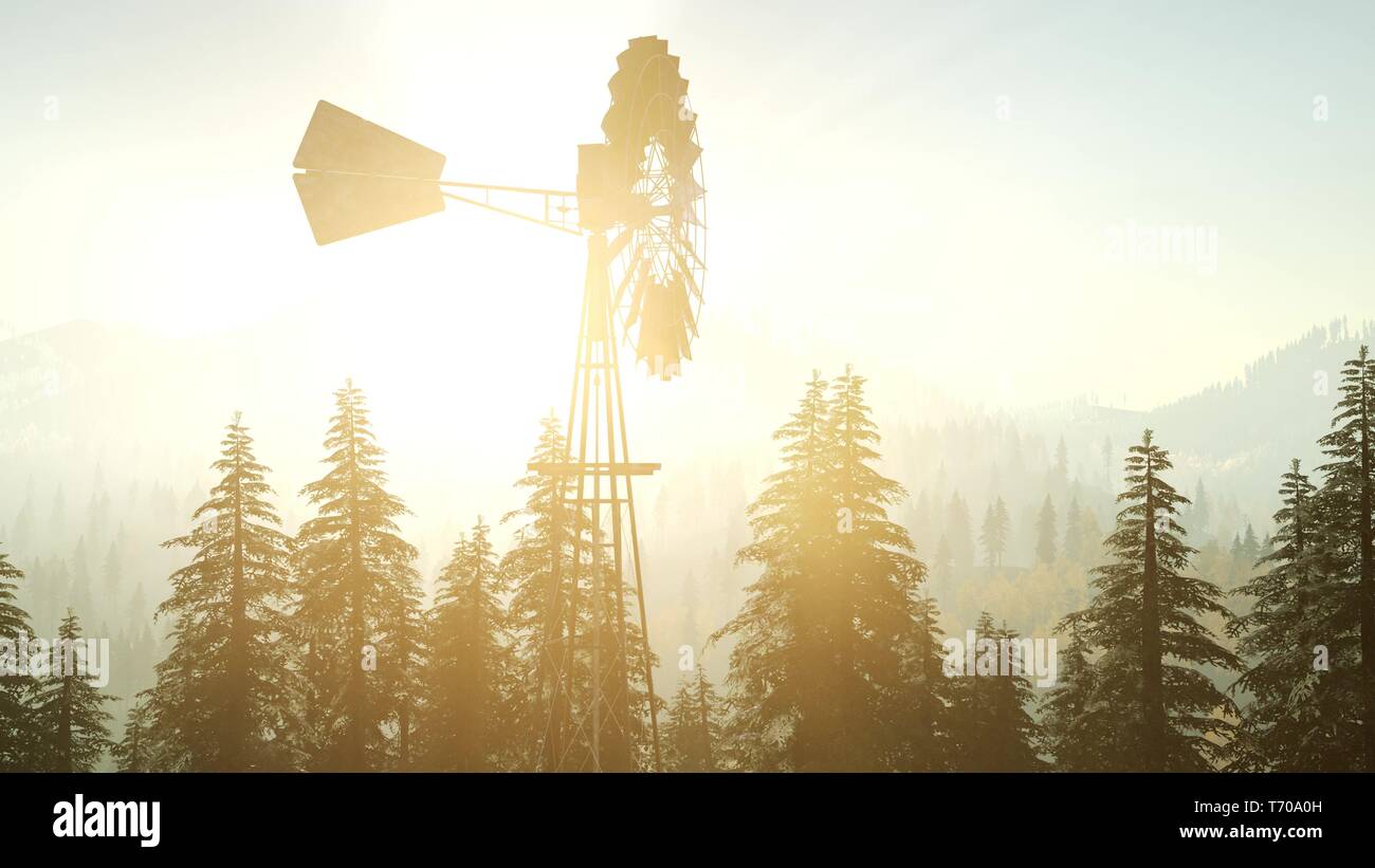 Typical Old Windmill turbine in forest at sunset Stock Photo - Alamy
