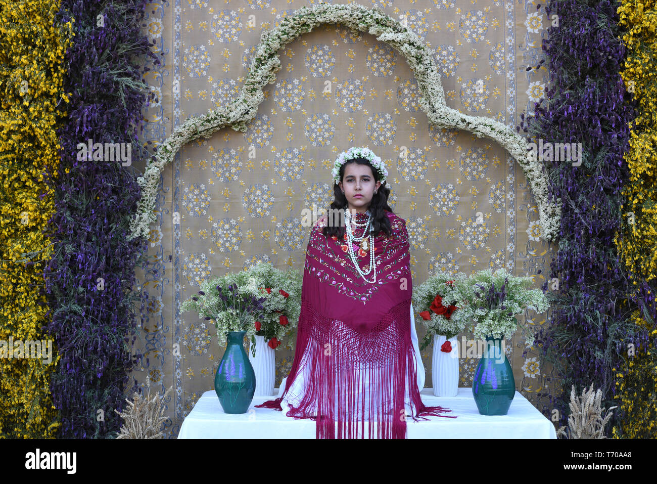 A Maya girl is seen seated in an altar during the traditional ...