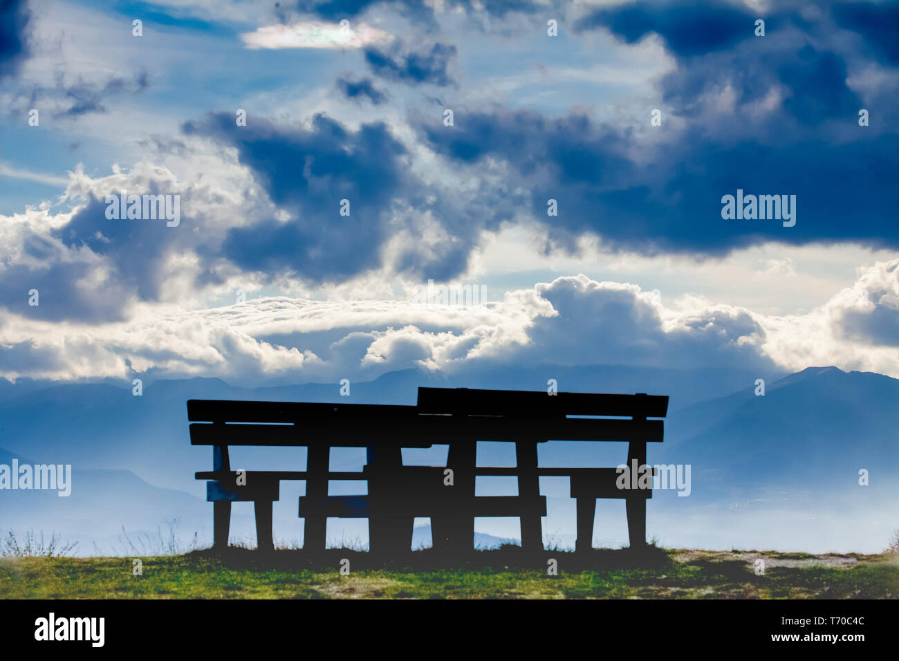 benches and table in the clouds Stock Photo - Alamy