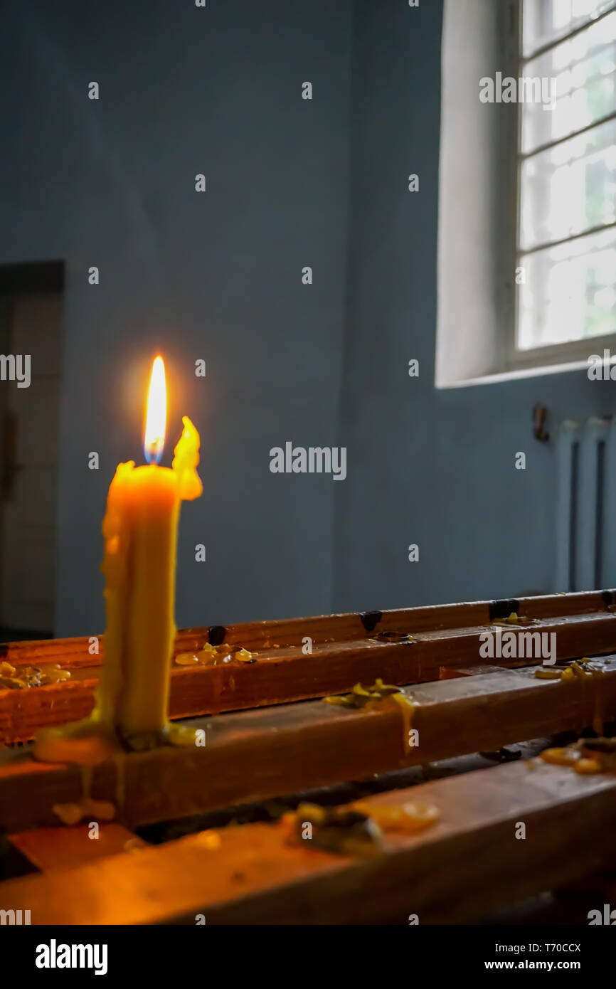 Burning candle at Koknese Evangelical Lutheran Church Stock Photo - Alamy