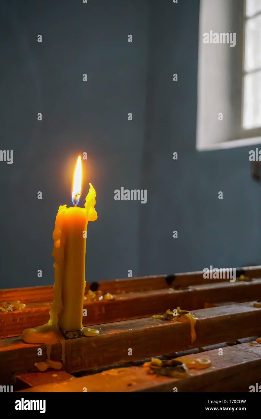 Burning candle at Koknese Evangelical Lutheran Church Stock Photo - Alamy
