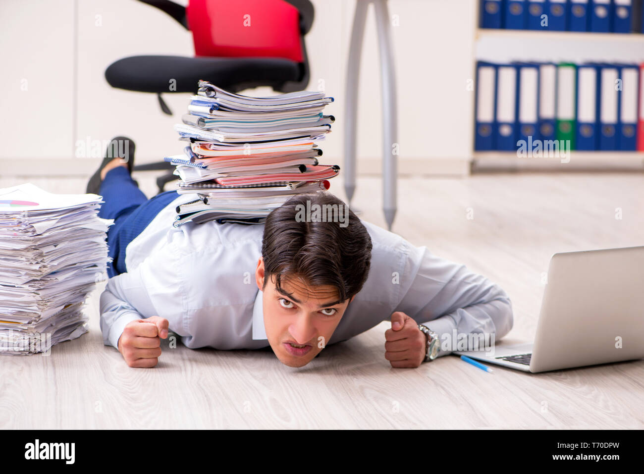 Extremely busy employee working in the office Stock Photo - Alamy
