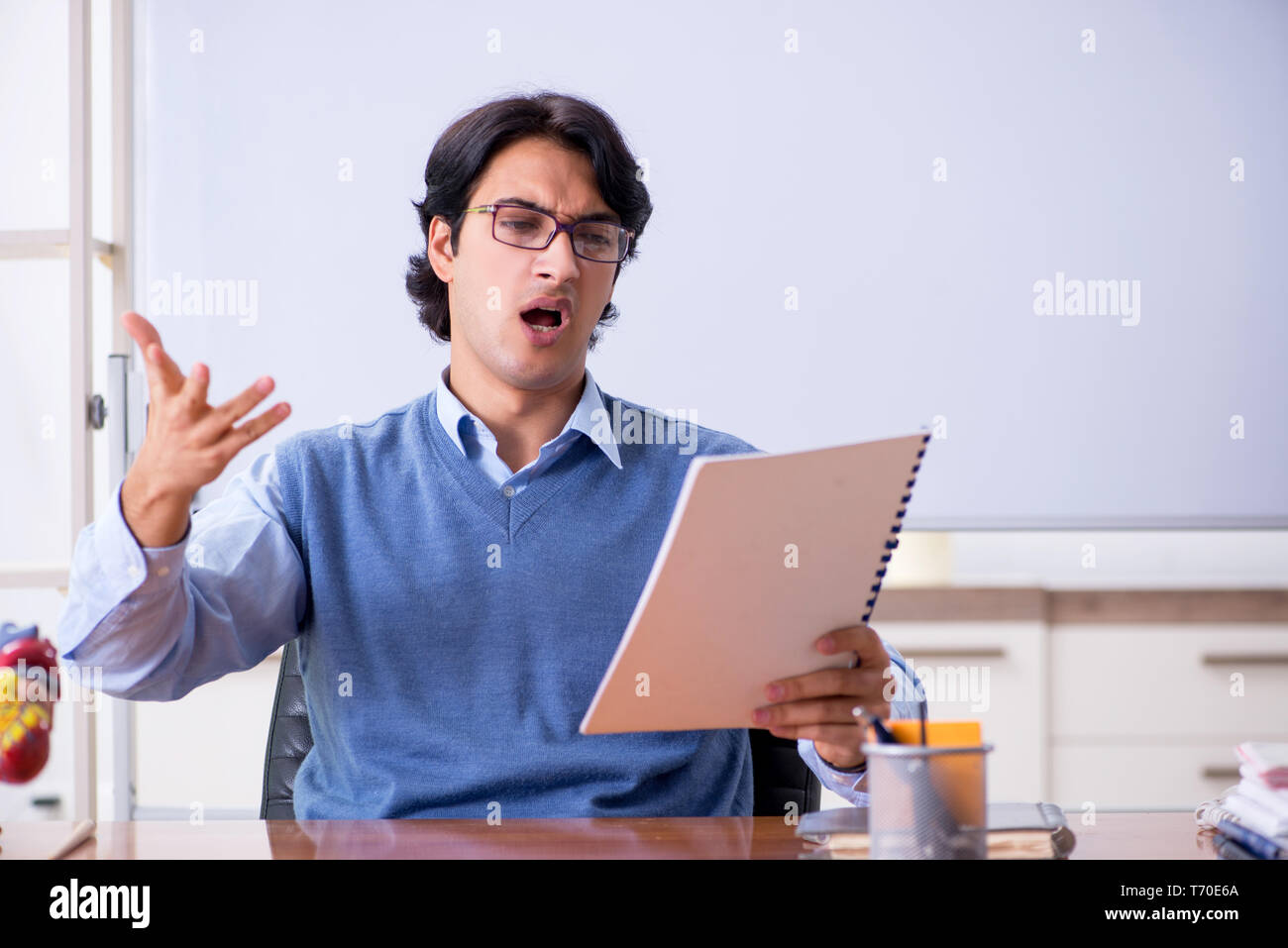 Young lecturer teacher teaching anatomy Stock Photo - Alamy