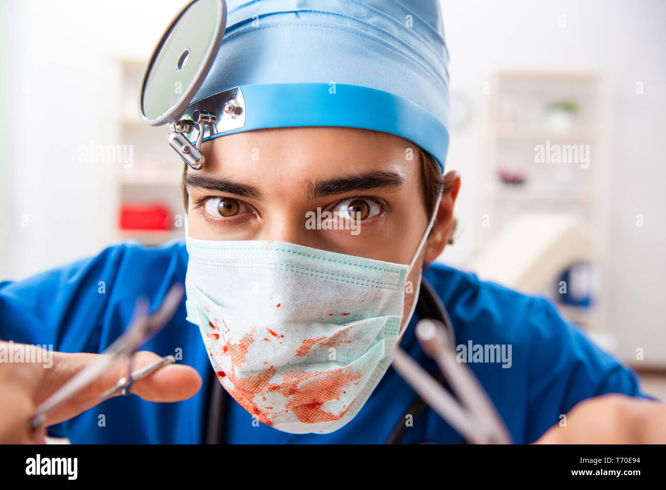 Mad doctor working in the clinic Stock Photo - Alamy