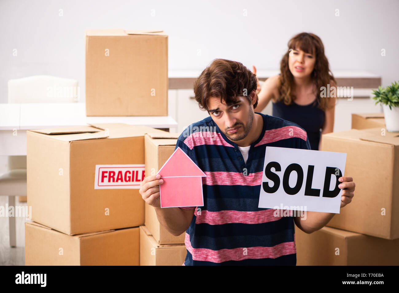 Young family selling their house Stock Photo - Alamy