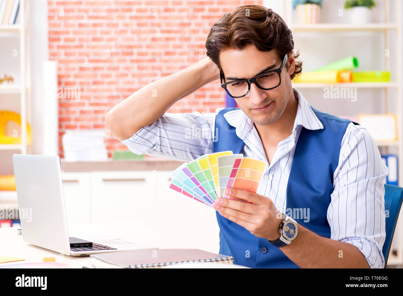 Young designer freelancer working on new project Stock Photo - Alamy