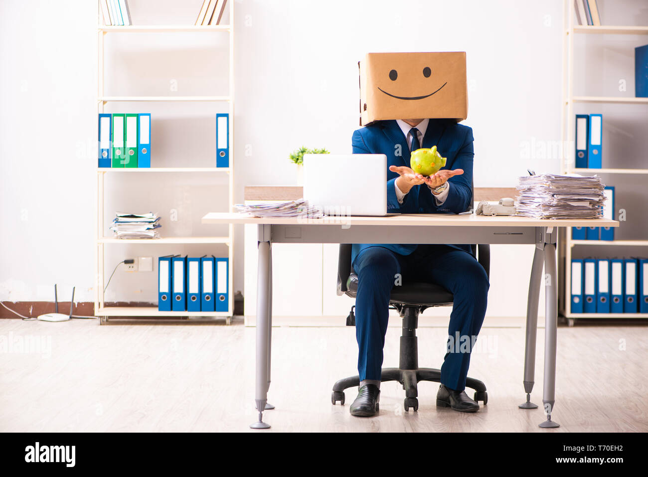Happy man employee with box instead of his head Stock Photo - Alamy