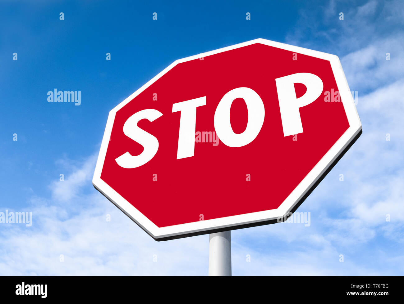 Stop sign against blue sky Stock Photo - Alamy