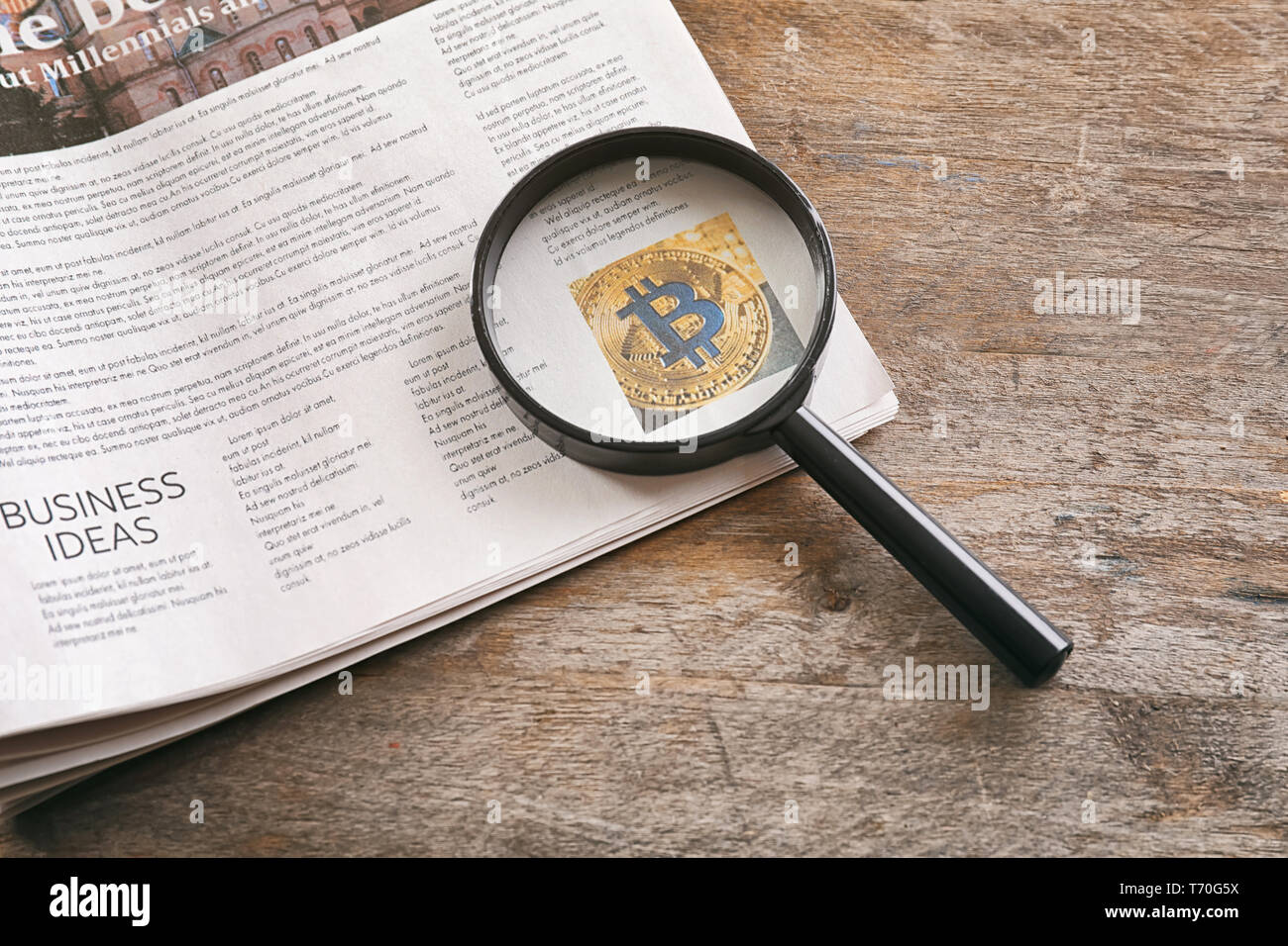 Reading newspaper magnifying glass hi-res stock photography and images ...
