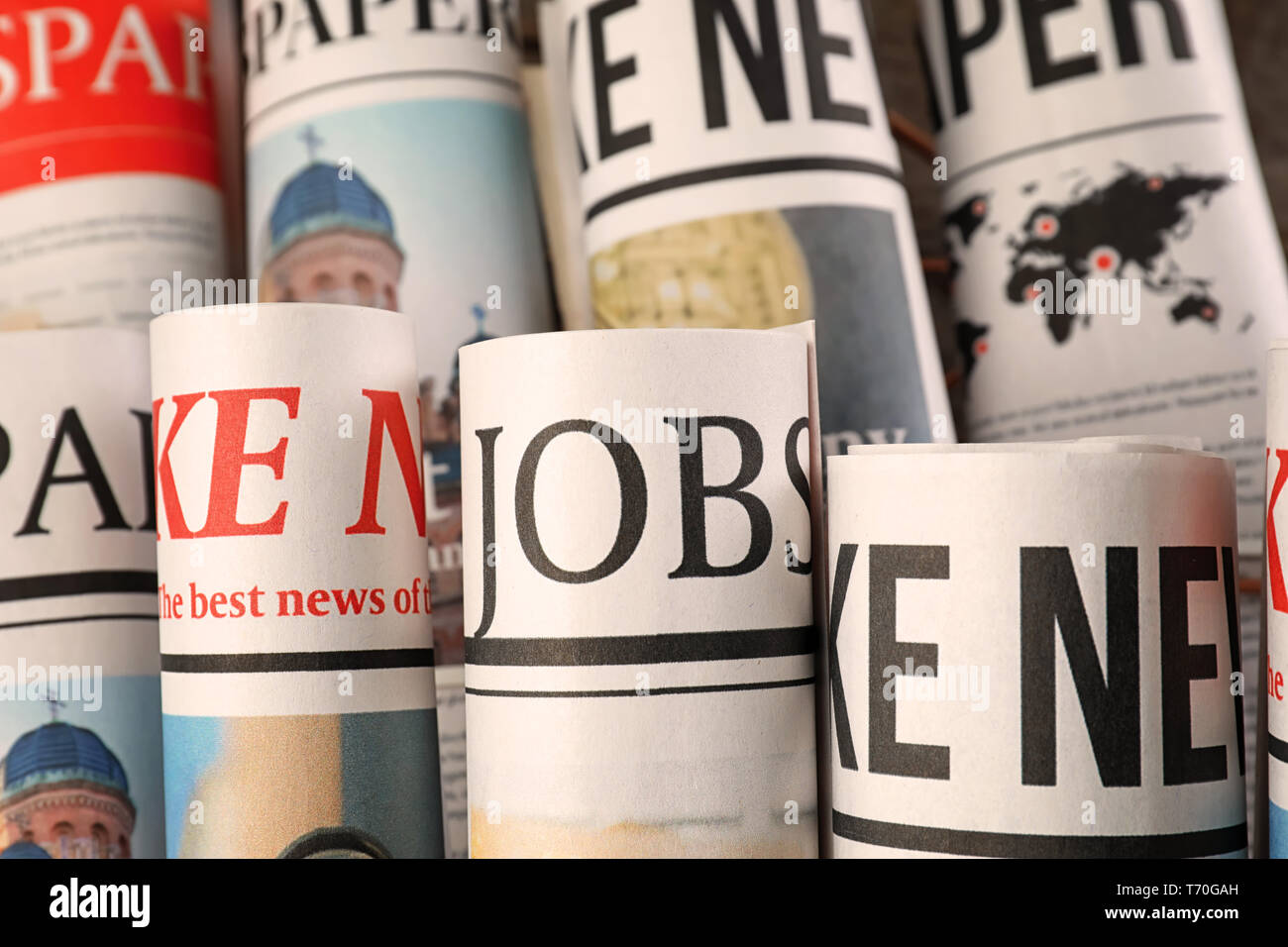 Rolled newspapers, closeup Stock Photo - Alamy
