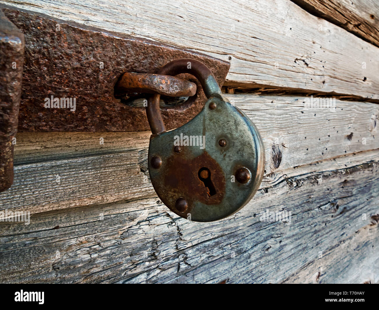 Lock hangs on iron hi-res stock photography and images - Alamy