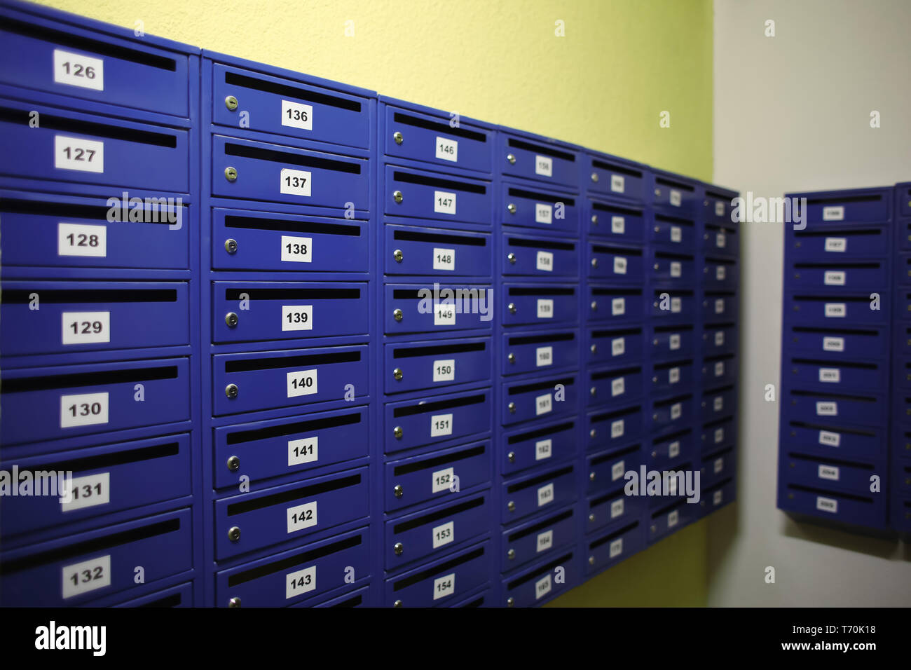 Mailboxes on wall in residential building Stock Photo - Alamy