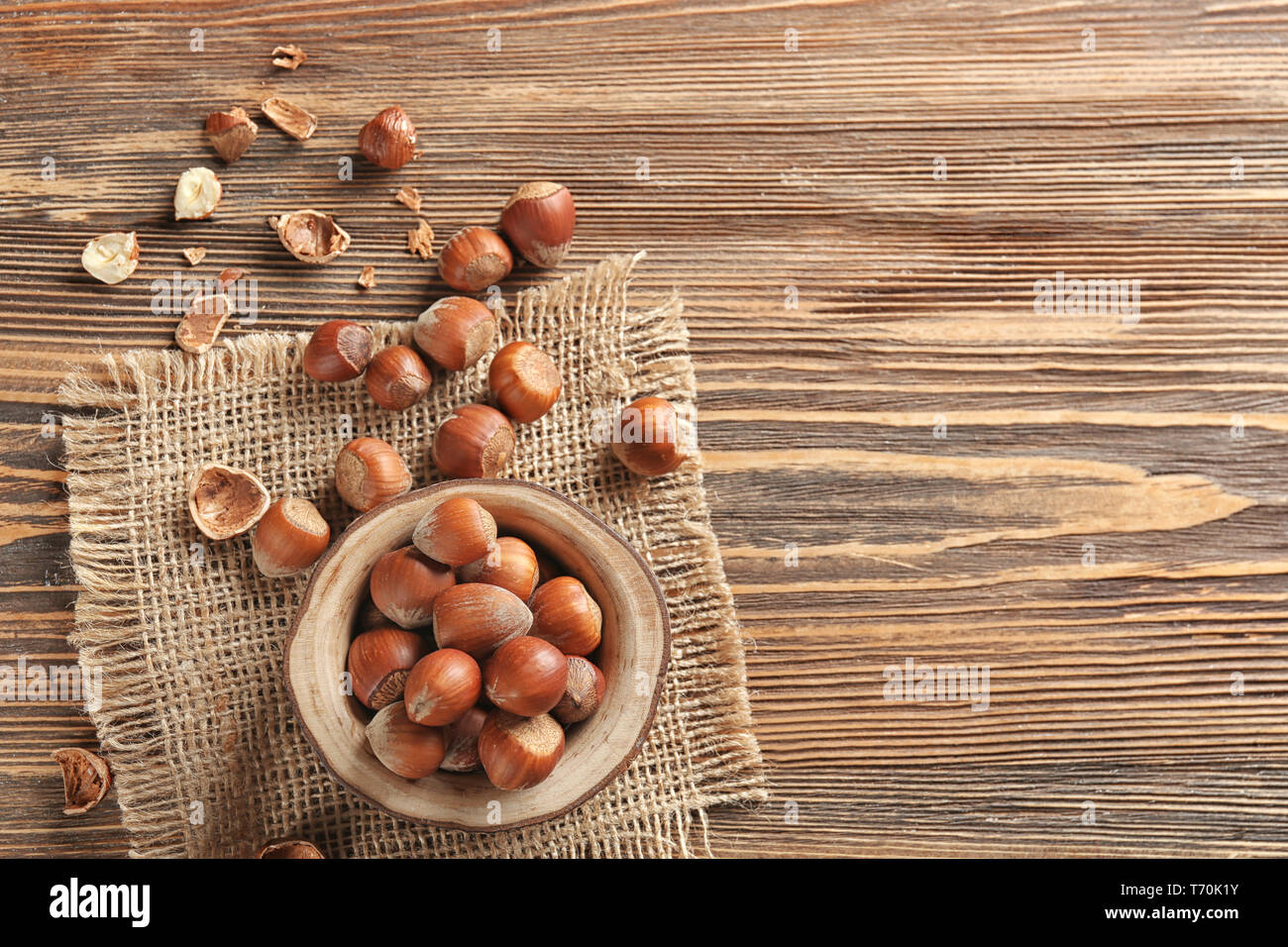 Unpeeled hazelnuts on wooden hi-res stock photography and images - Alamy