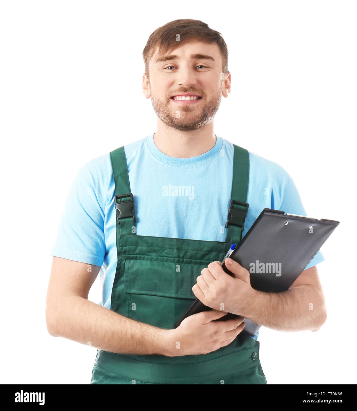 Young car mechanic with clipboard on white background Stock Photo - Alamy