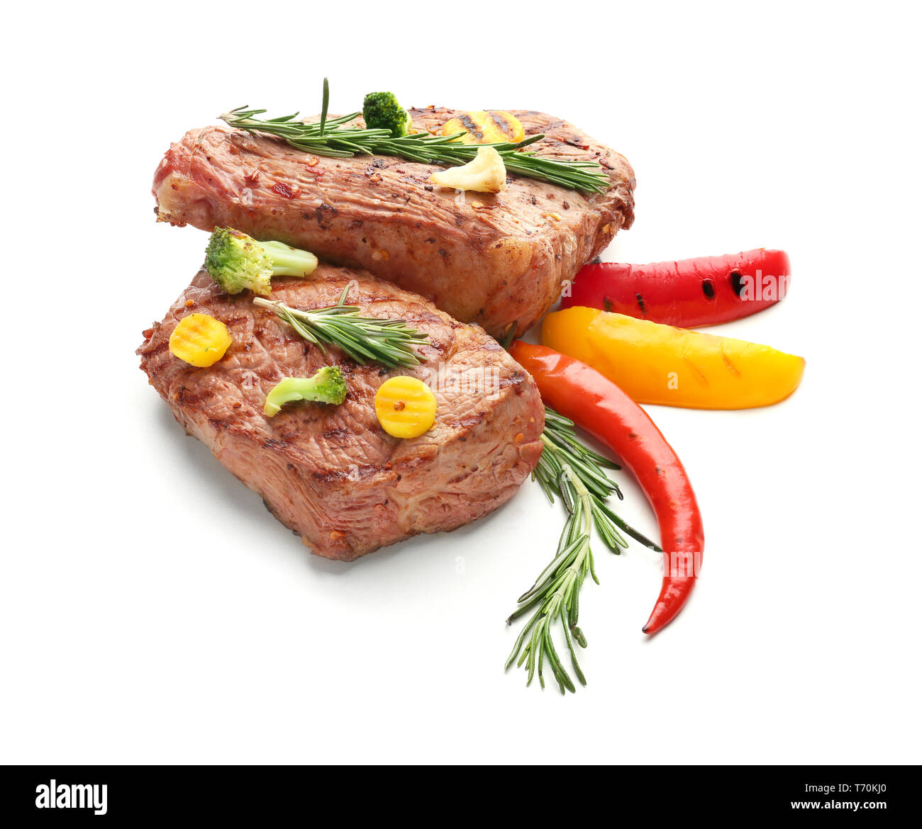 Grilled meat with vegetable garnish on white background Stock Photo - Alamy